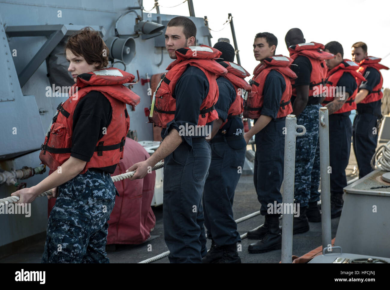 Sailors aboard USS Donald Cook (DDG 75) perform a man overboard drill ...