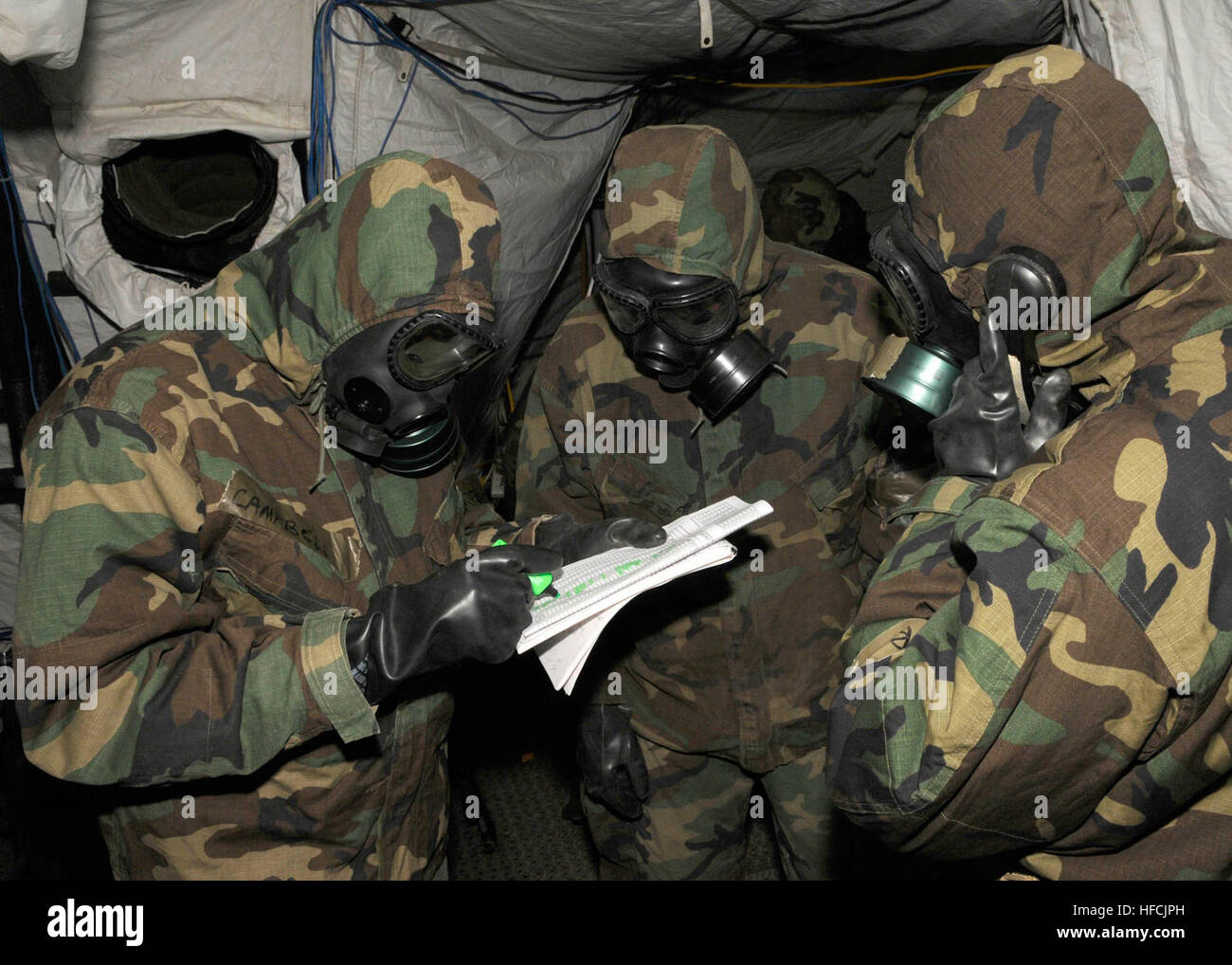 Seabees from the 30th Naval Construction Regiment (30 NCR) check the ...