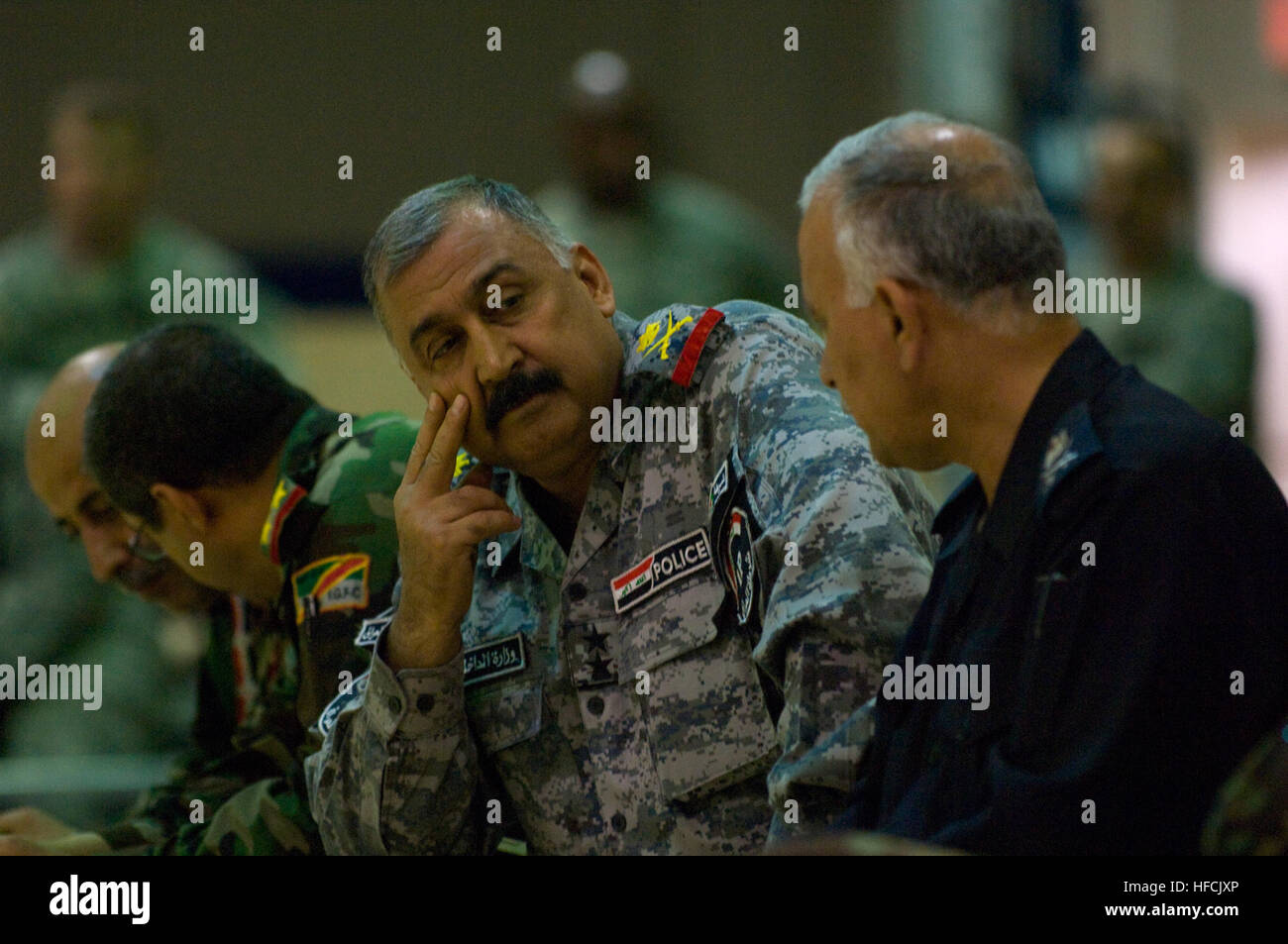 Iraqi Police General Ghanam converses with a colleague during the ...