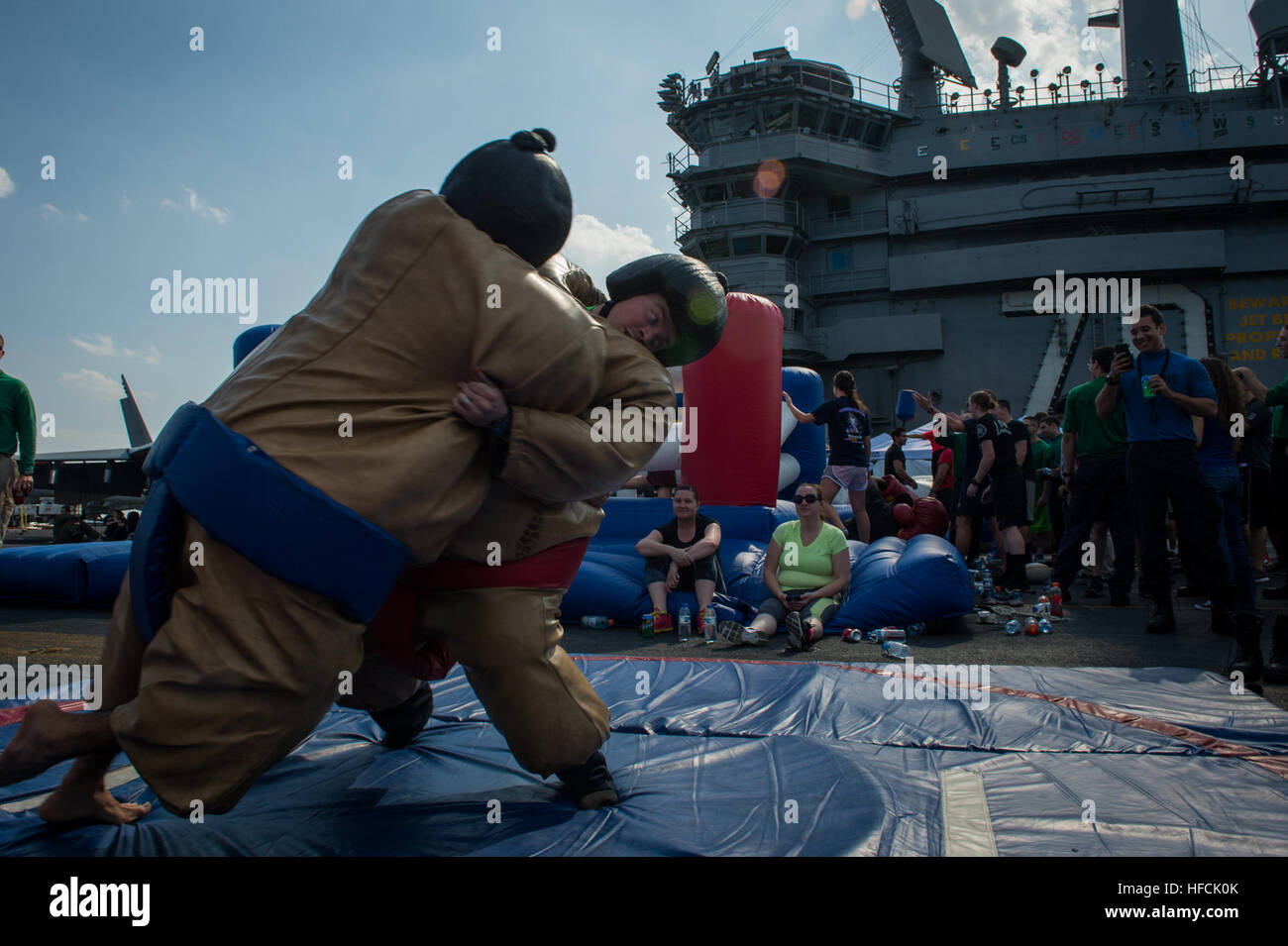 Sailors sumo wrestle during a steel beach picnic on the flight deck of ...