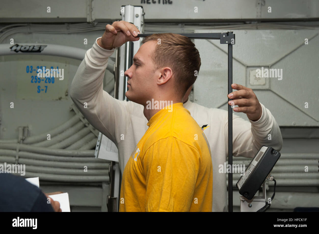 Quartermaster 3rd Class Christopher Teeter weighs-in during a bianual ...