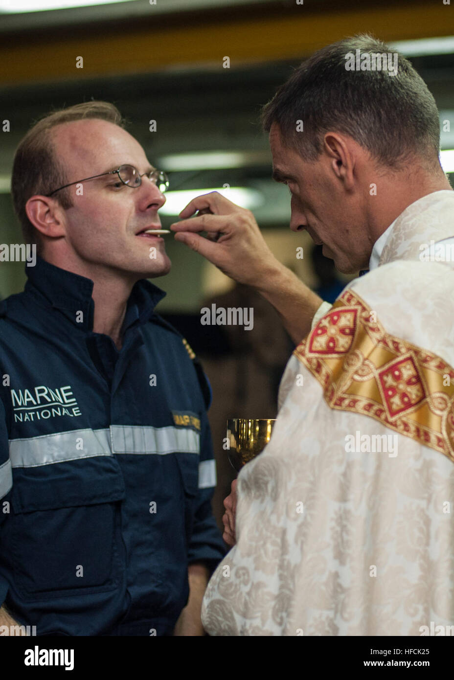 French Military Chaplain, Father Amaury Cariot, right, presides over ...