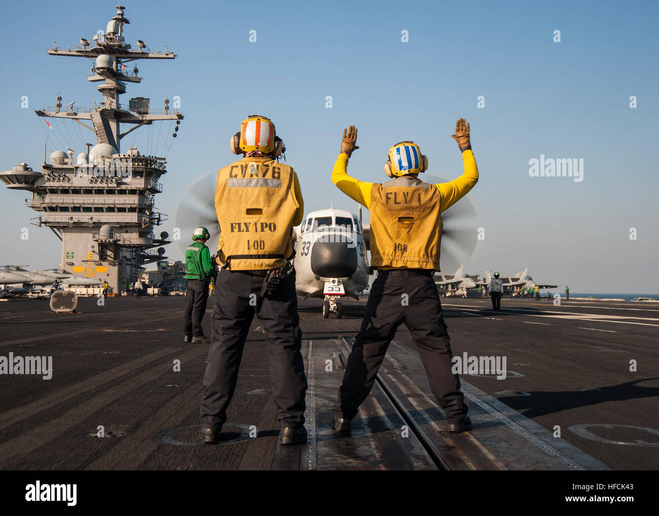 Aviation Boatswain’s Mate (Handling) 2nd Class Kristopher Smith, left ...