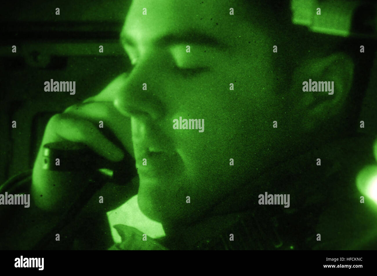 A U.S. Army Soldier makes a radio check prior to commencing a night ...