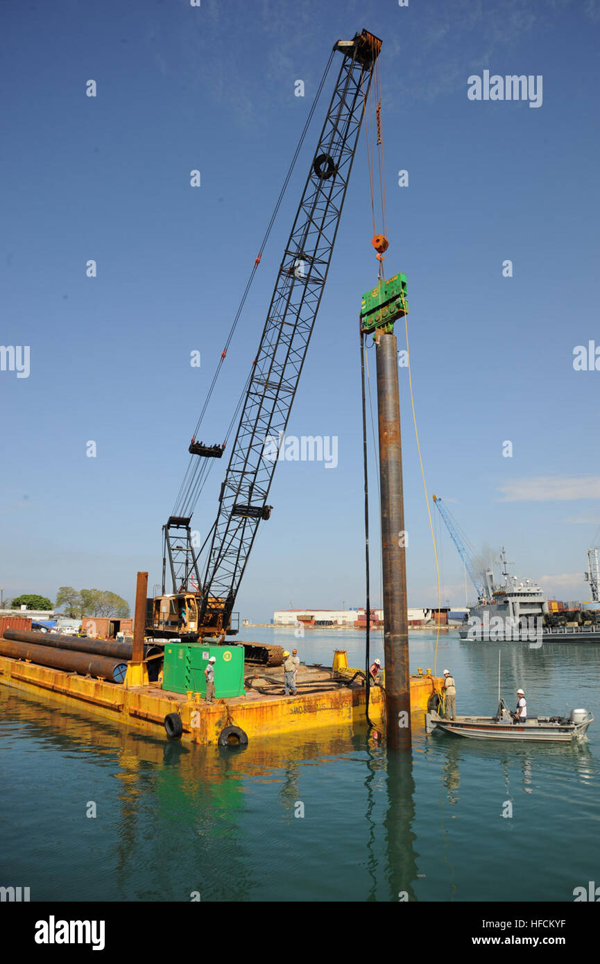 Salvage Technicians from the salvage tug Resolve Pioneer drive ...