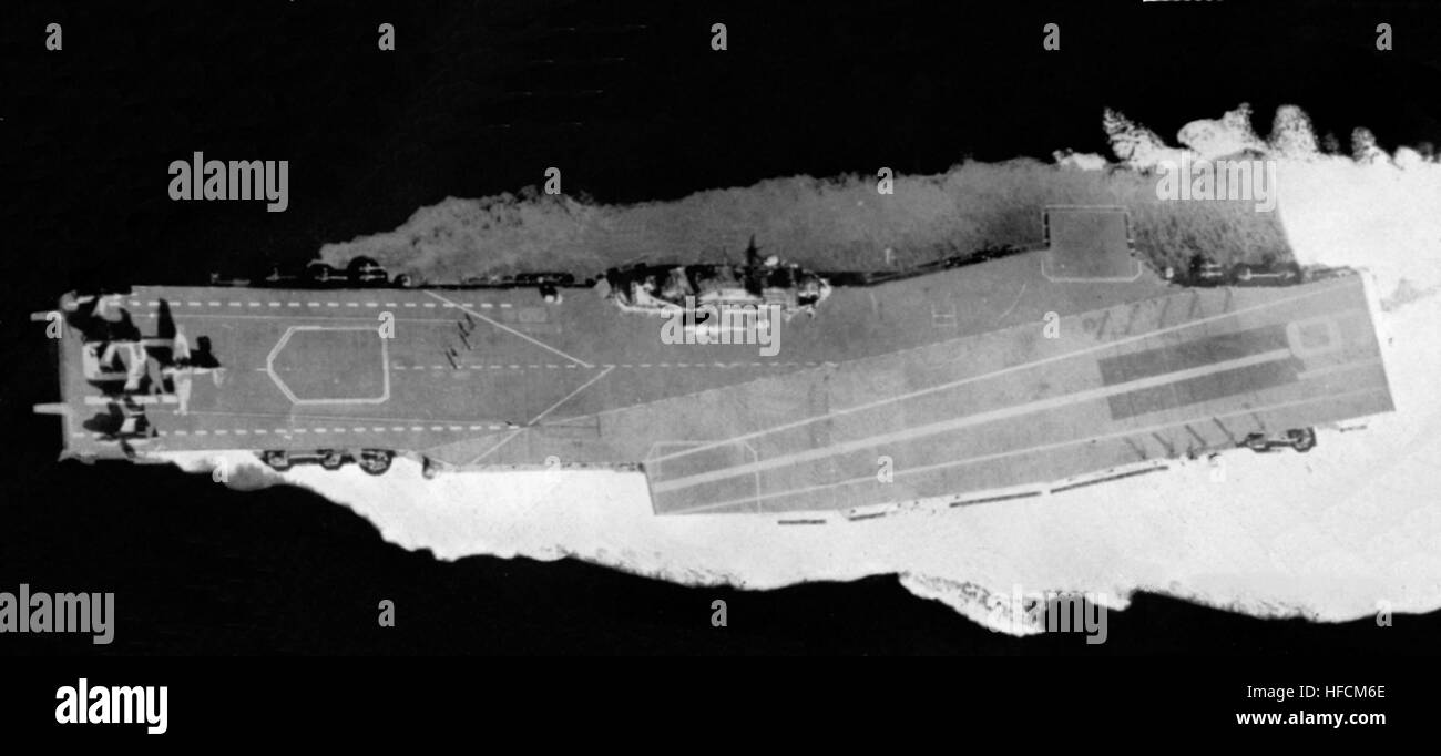 USS Hancock (CVA-19), an aircraft carrier, is underway with an overhead ...