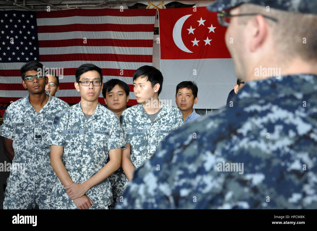 Sailors from the Republic of Singapore Navy listen as Chief Aviation ...