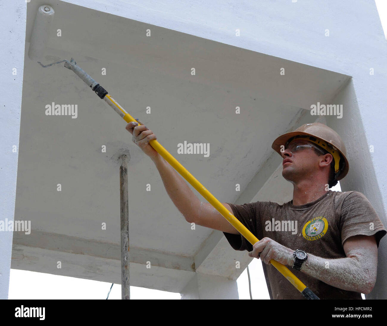 Seaman Christopher Kelly, engineering aide from Schertz, Md., paints a ...