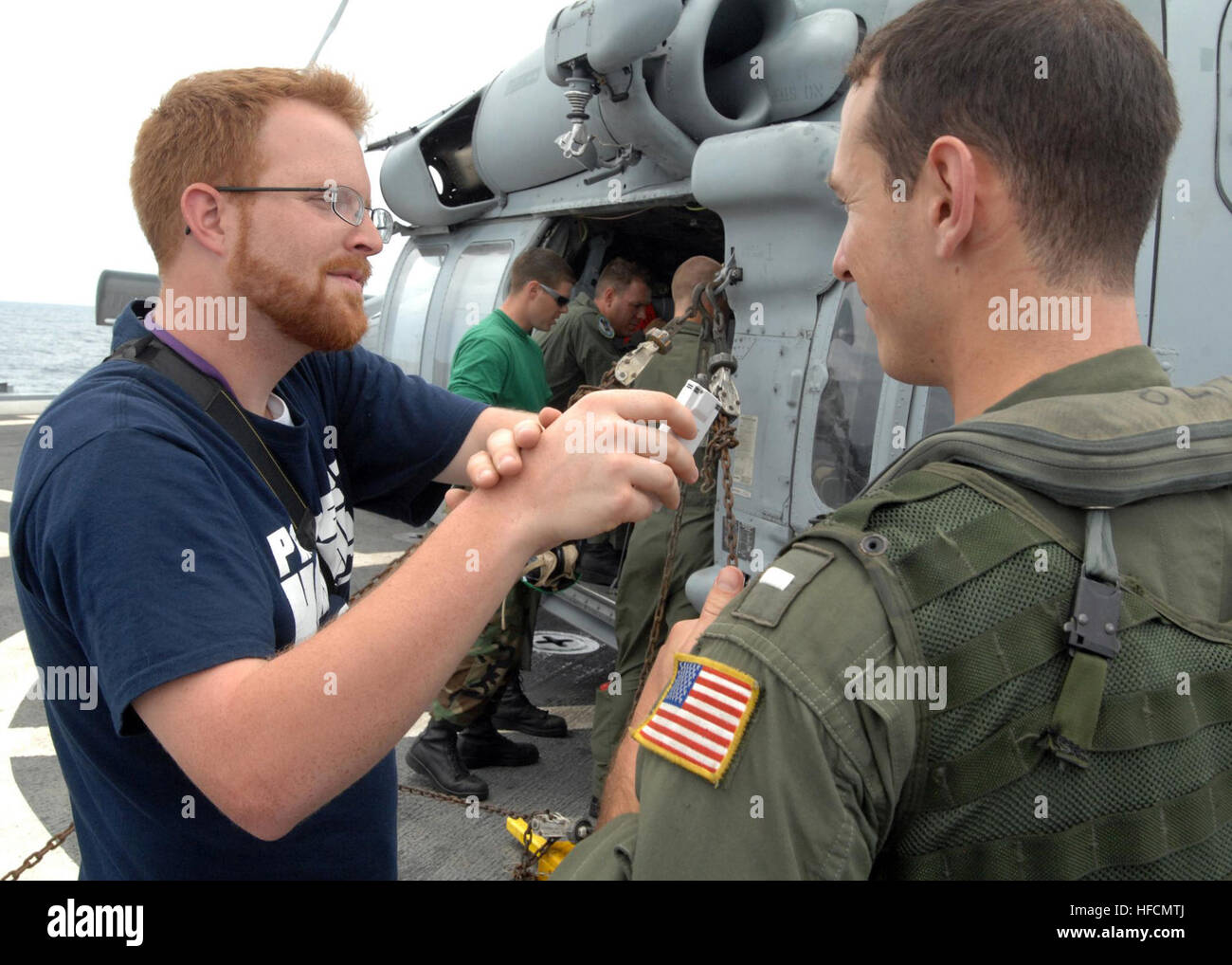 Project Hope photographer Christopher Radder interviews a Navy pilot in ...
