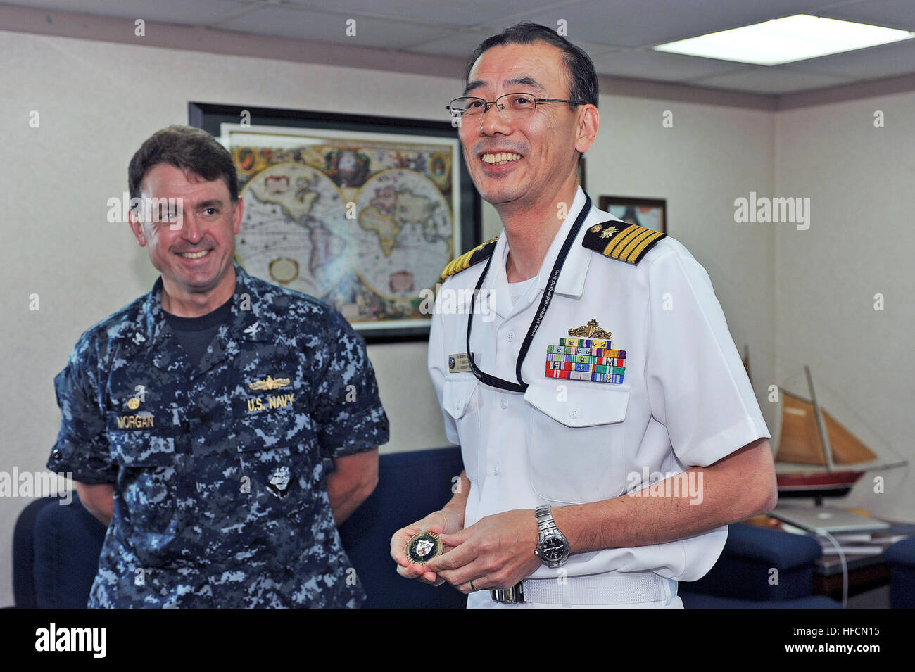 U.S. Navy Capt. James Morgan, left, the mission commander for Pacific ...