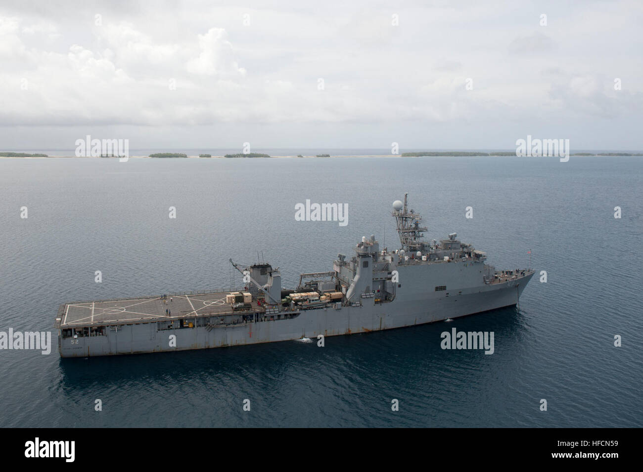 The amphibious dock landing ship USS Pearl Harbor (LSD 52) is anchored ...