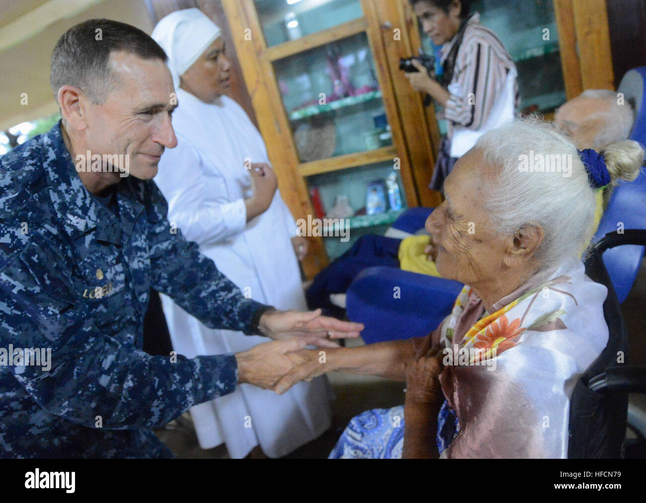 U.S. Navy mission commander engages with residents of Little Sisters of ...