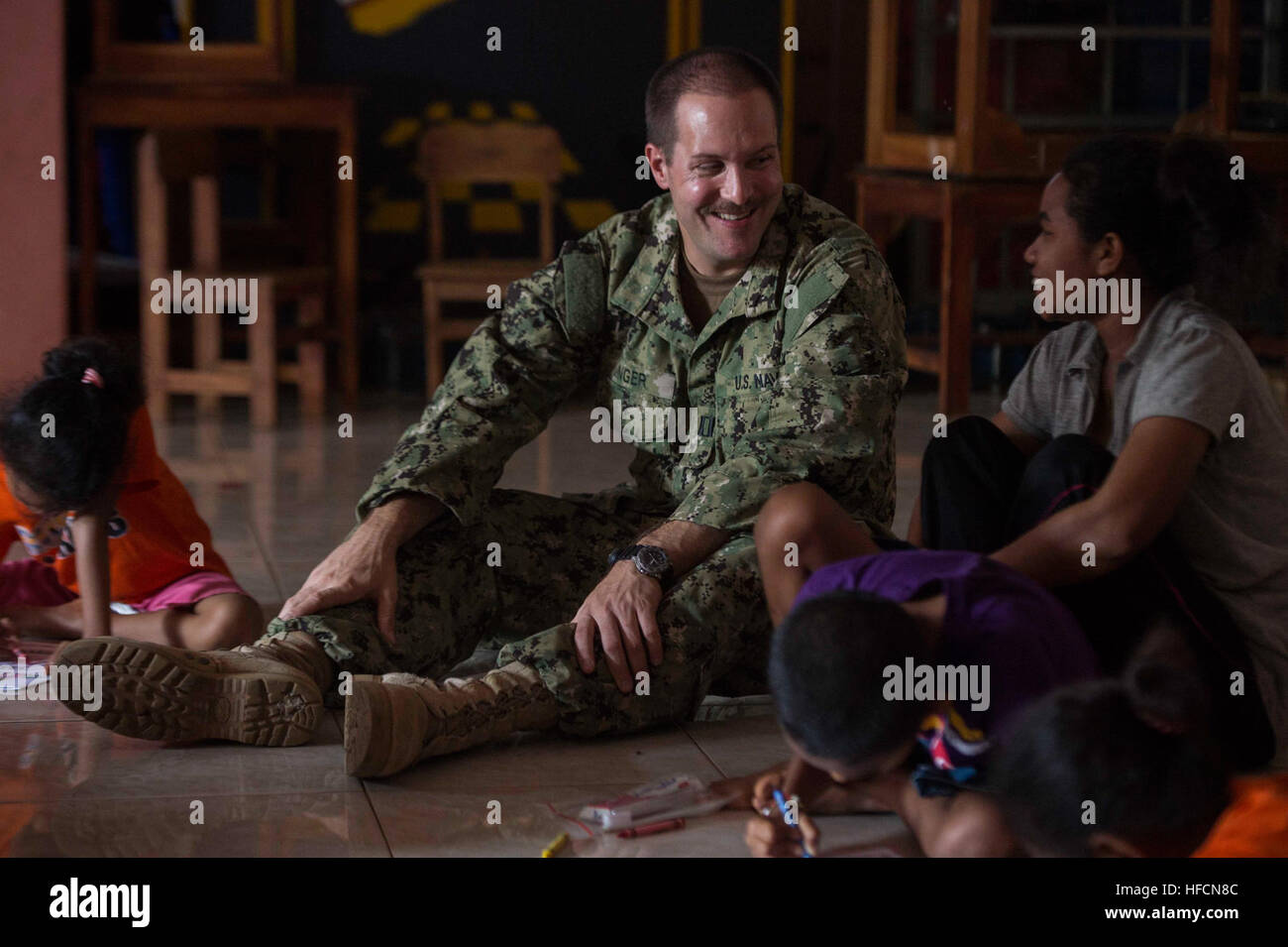 U.S. Navy Lt. Rob Singer, left, assigned to the Regional Legal Service ...