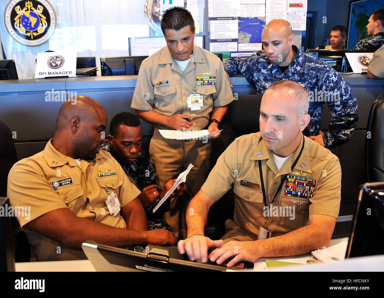 Colombian navy Capt. Edwin Feria, center, lead battle watch captain ...
