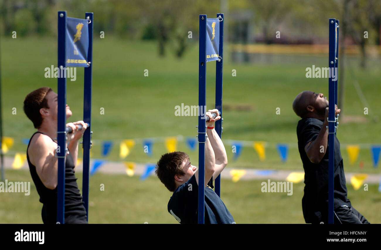 Participants execute as many pull-ups as possible in a two-minute time ...