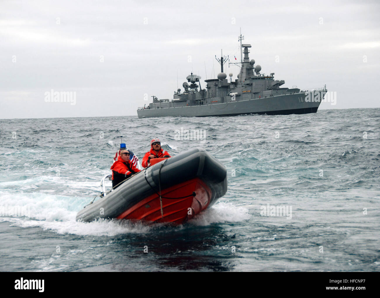 Chilean ship Almirante Latorre (FFG 14) sails in the distance while ...