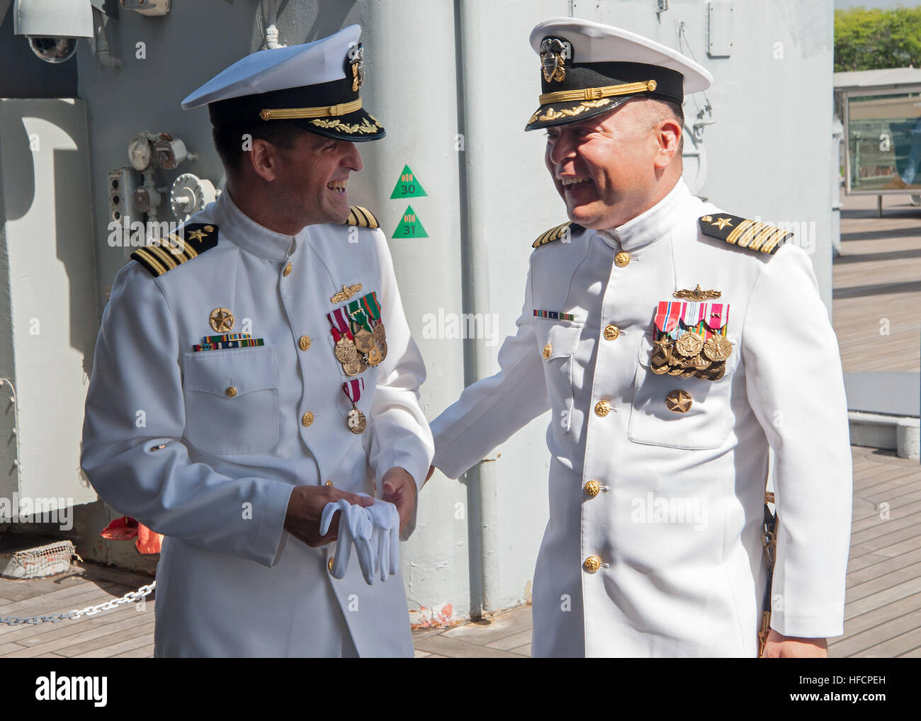 Capt. Eric F. Weilenman exchanges words with Capt. Adolfo H. Ibarra ...