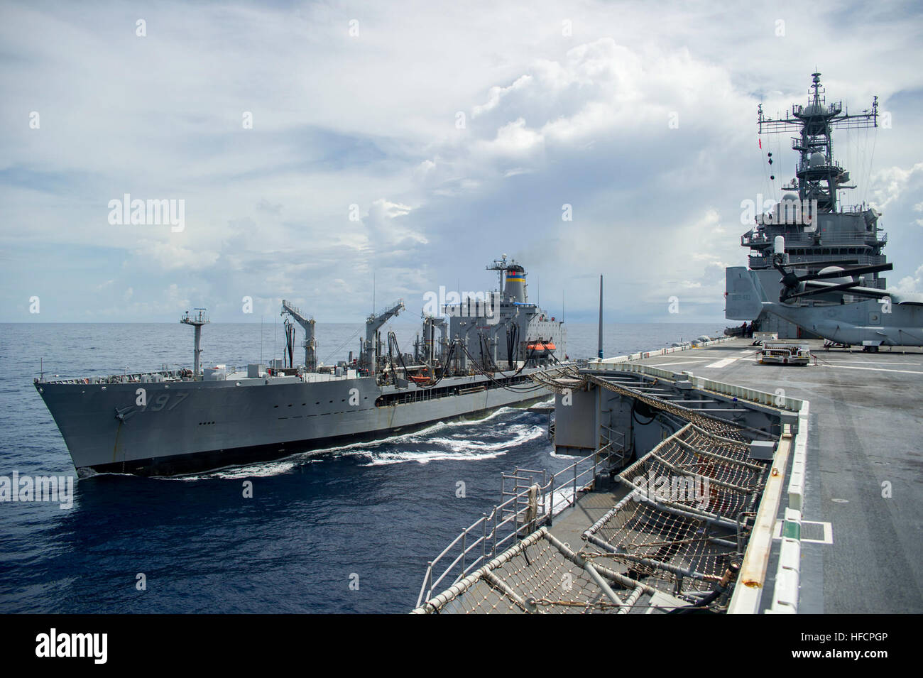 The fleet replenishment oiler USNS Pecos (T-AO 197) steams alongside ...