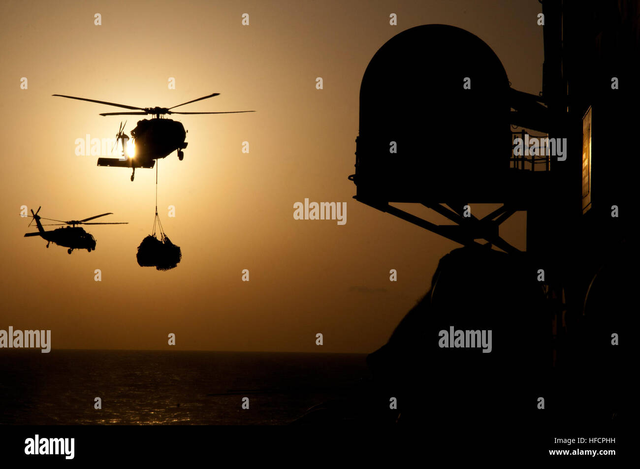 Two MH-60S Knighthawk helicopters assigned to the "Wild Cards" of ...