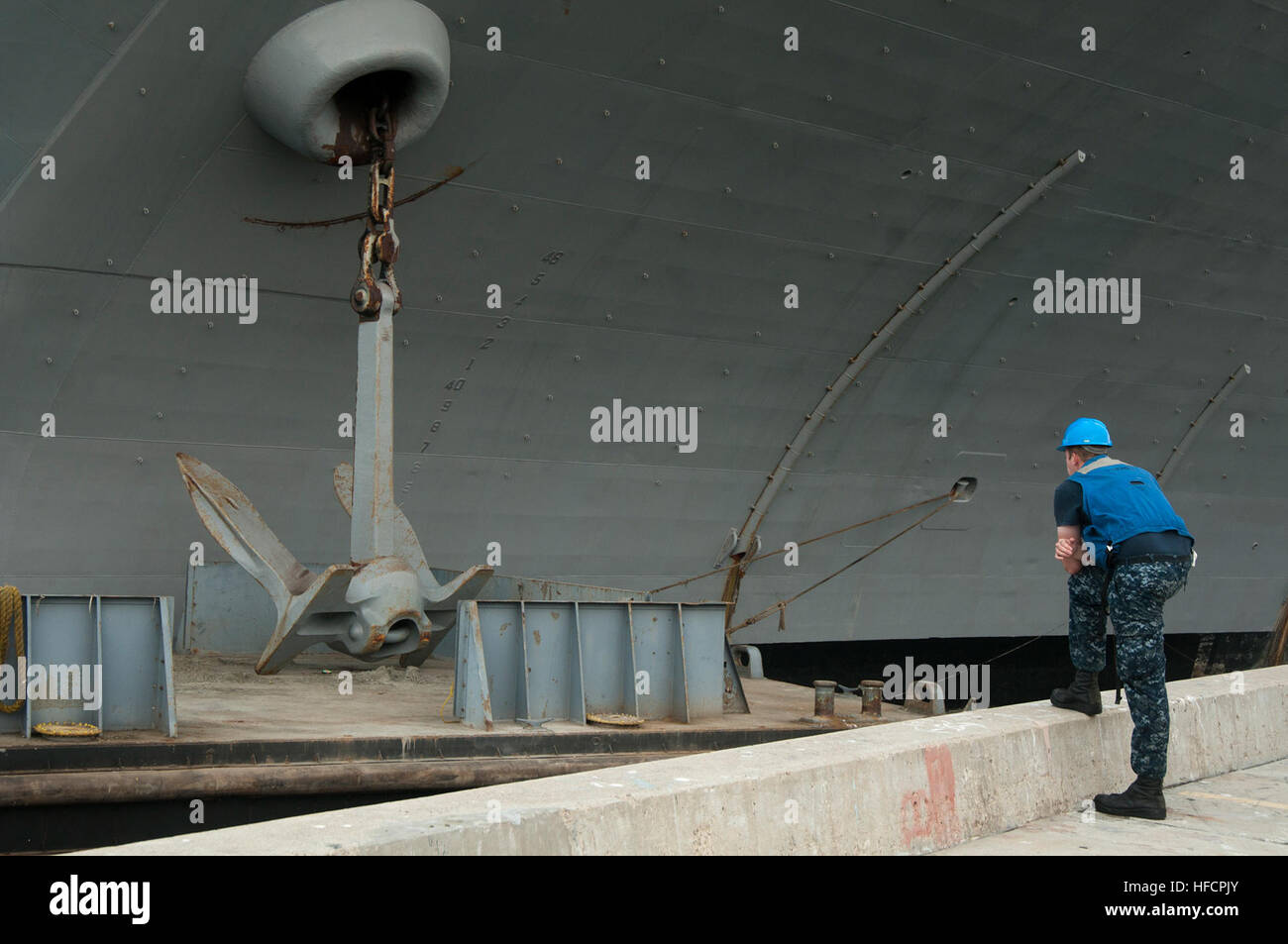 Boatswains Mate 3rd Class Kyle Beckman supervises the port side anchor ...