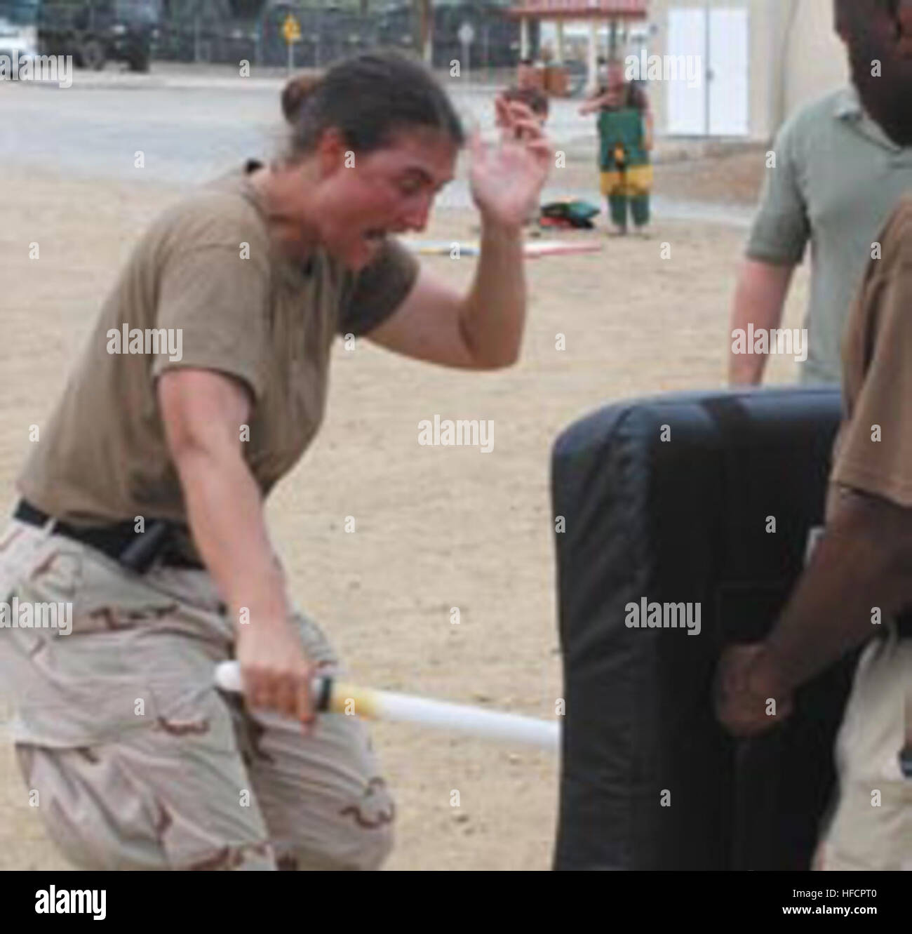 Petty officer breanne smith must strike a mat with a baton after being ...