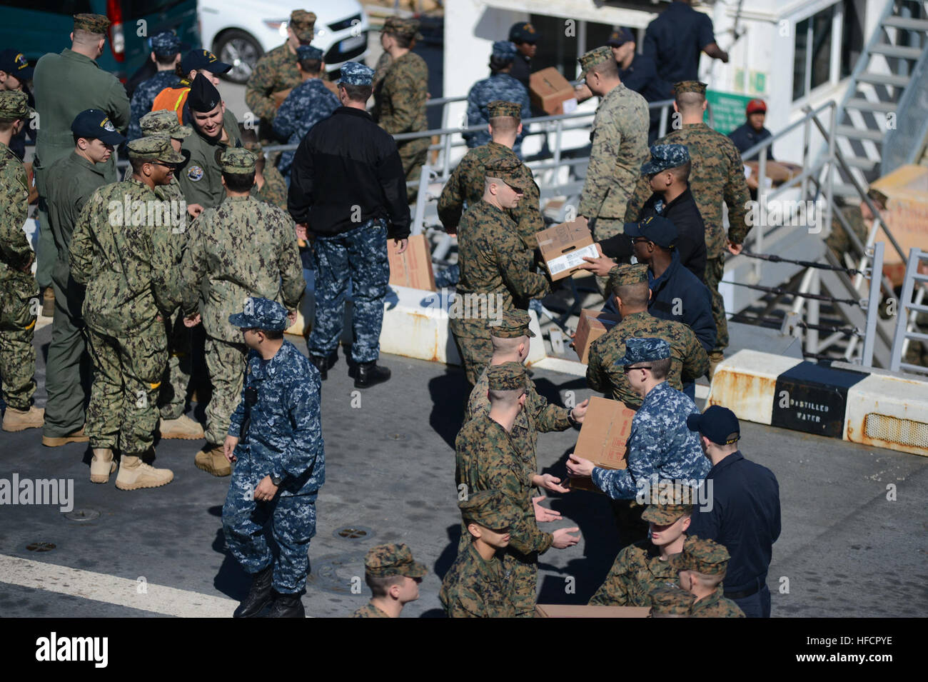 U.S. Marines assigned to the 22nd Marine Expeditionary Unit and Sailors ...