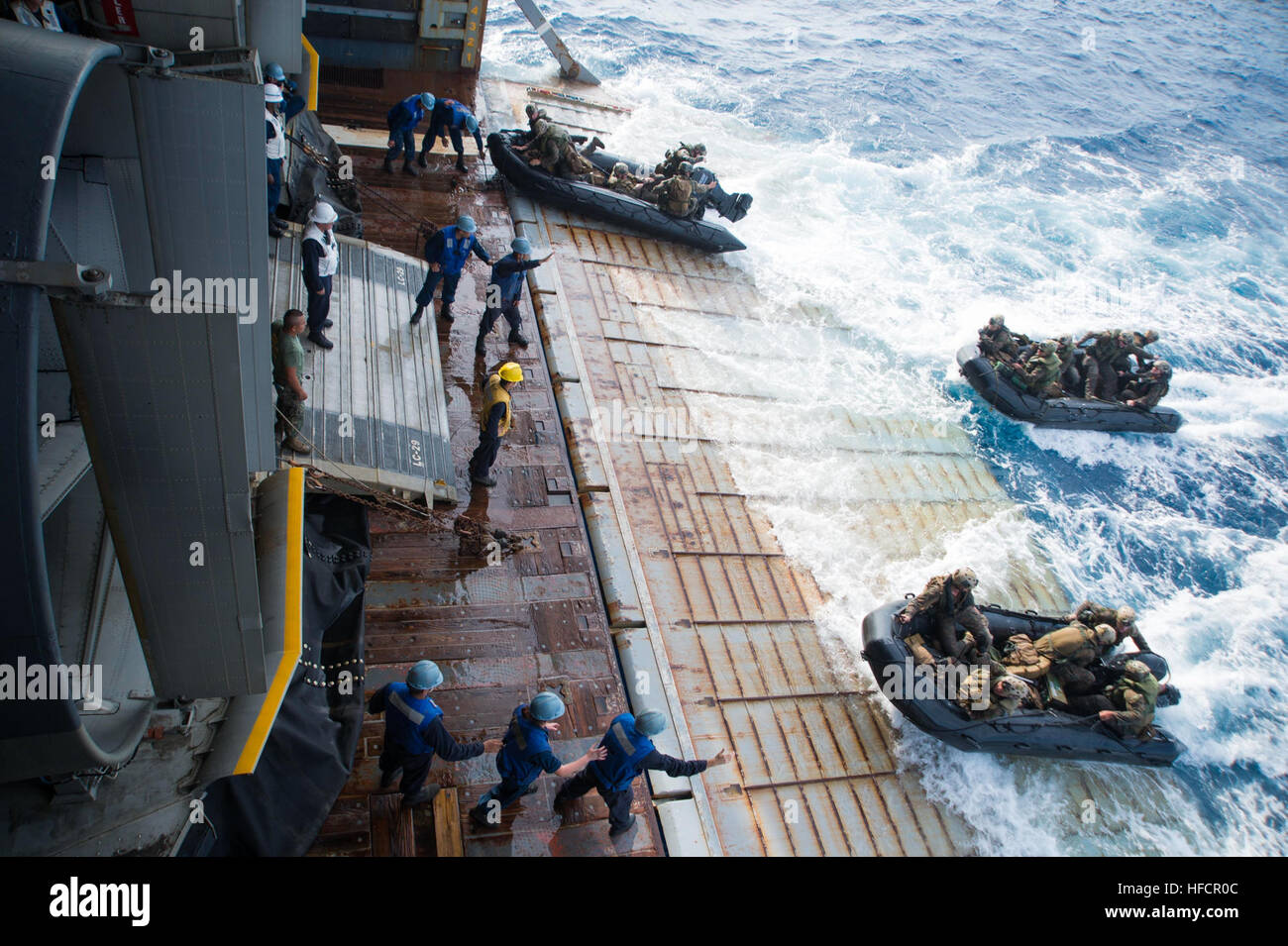 Sailors aboard the amphibious dock landing ship USS Germantown (LSD 42 ...