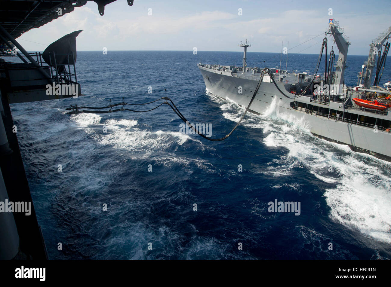 Crew members aboard the fleet replenishment oiler USNS John Ericsson (T ...