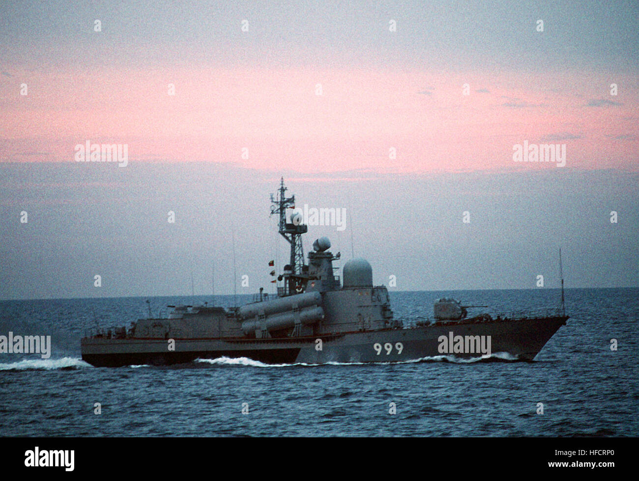 A Soviet Tarantul III Class missile corvette provides an escort for two ...