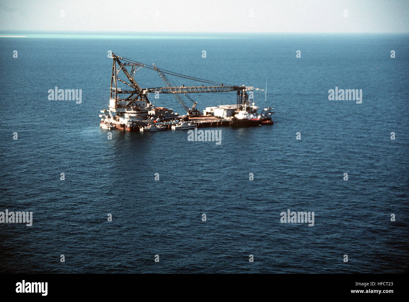 Location: Persian Gulf. An aerial view of the barge HERCULES with three ...