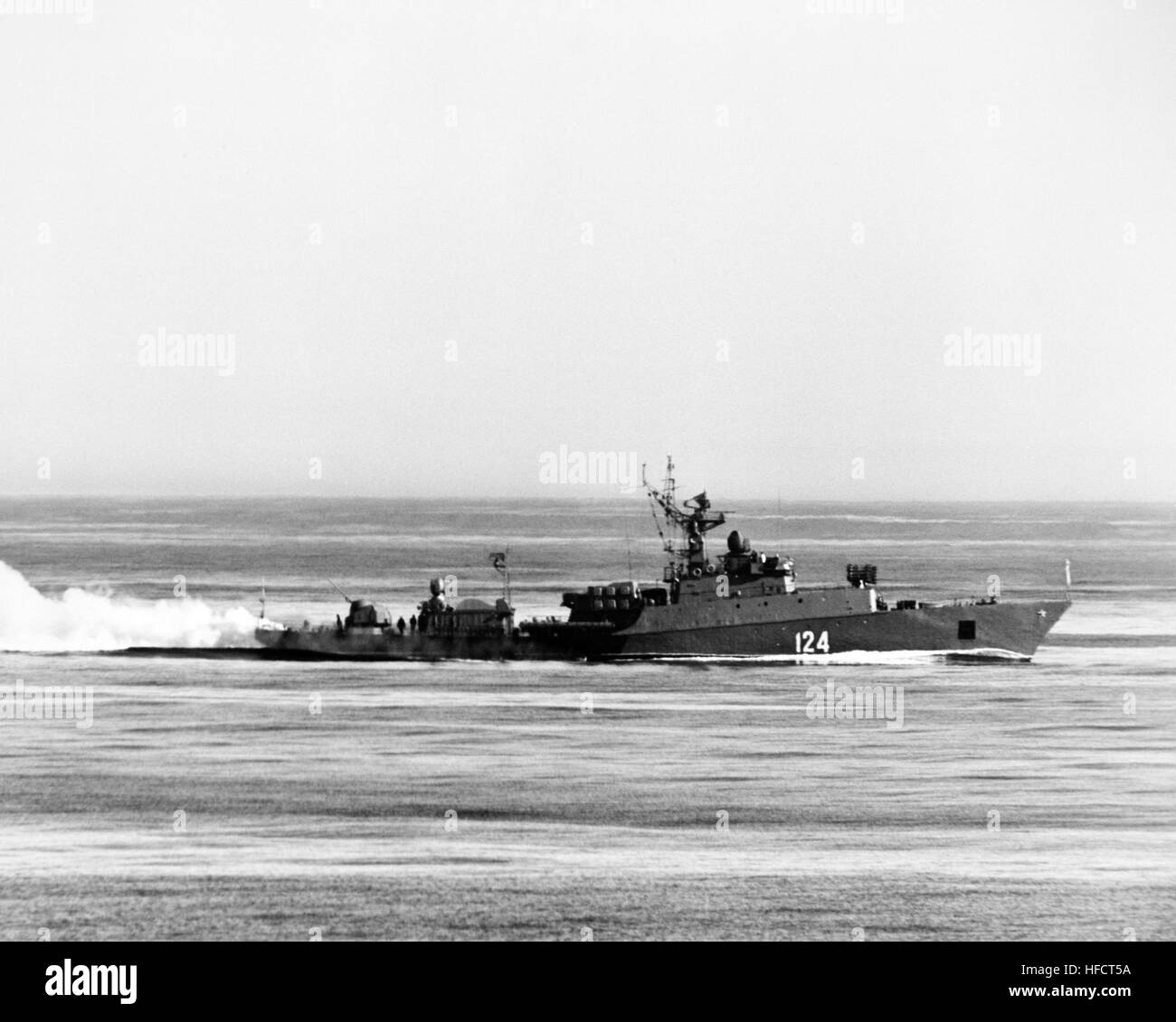 A starboard beam view of a Soviet Grisha-I light frigate laying a smoke ...