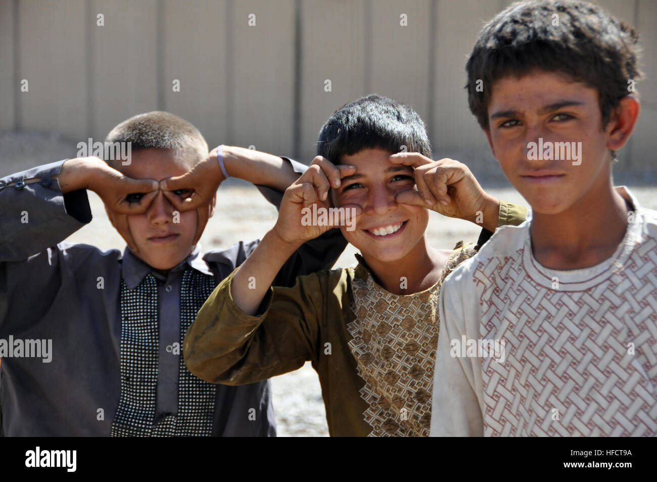 Local Afghan boys pose for a photo outside Forward Operating Base Farah ...