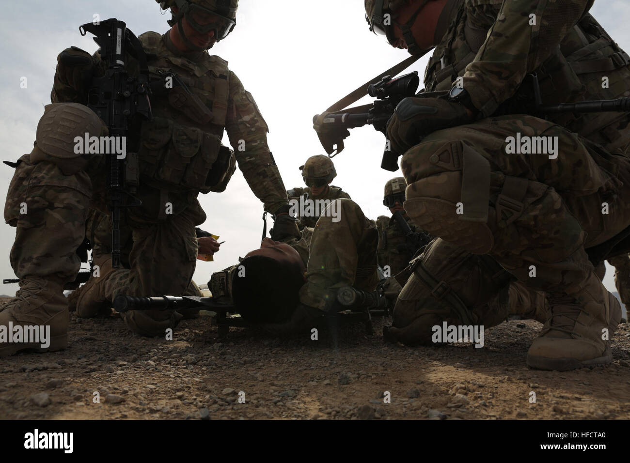 U.S. Army Spc. Joseph Henry (kneeling left) and Spc. Scott Yeates ...
