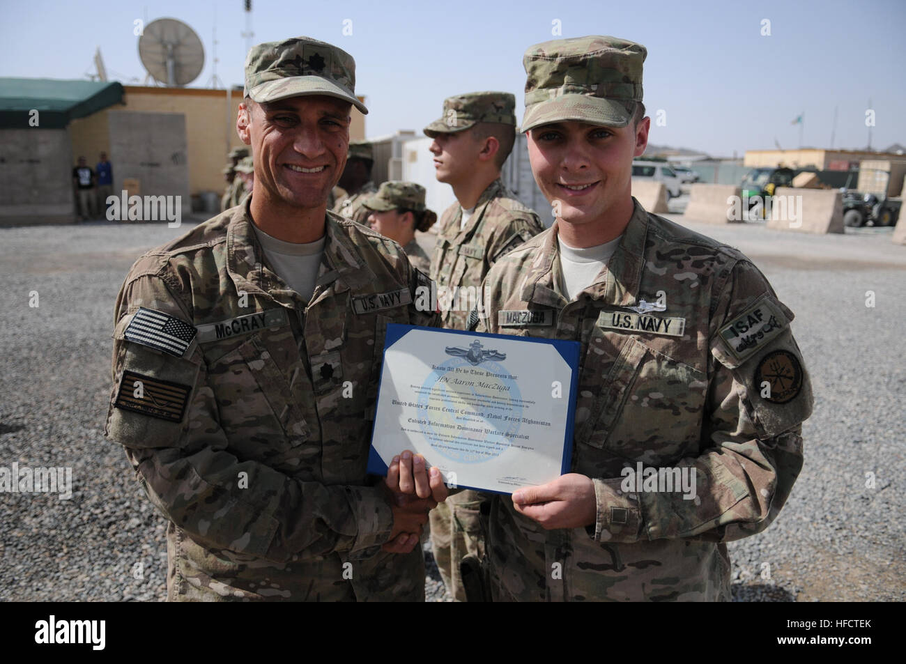 U.S. Navy Cmdr. Louis McCray, left, commanding officer of Provincial ...