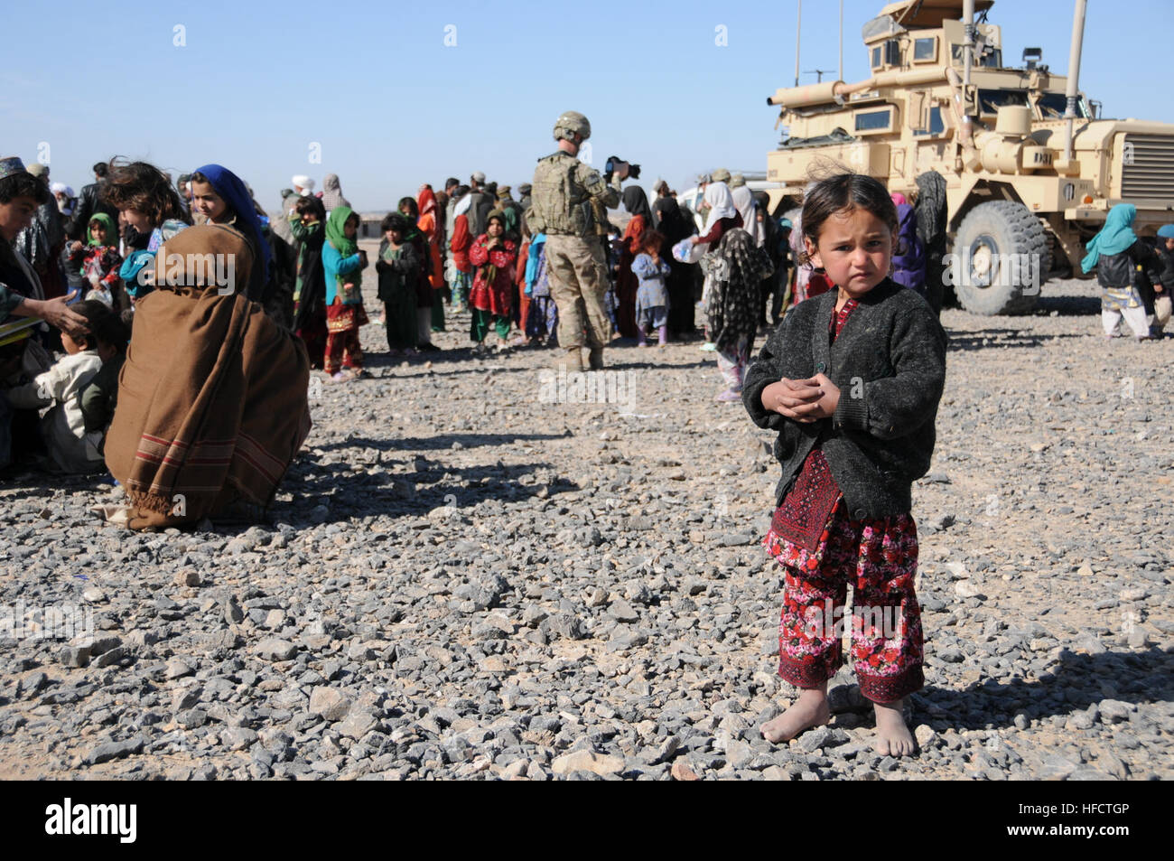 A young Farahi girl stands barefooted in her village in Farah City, Feb ...