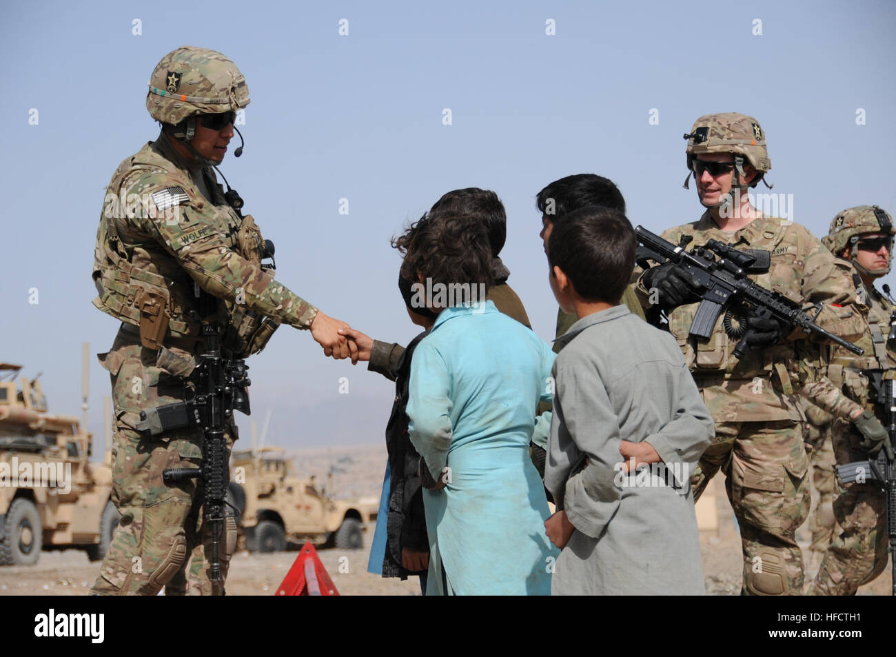 U.S. Army 1st Lt. Robert Wolfe, left, platoon leader for Provincial ...