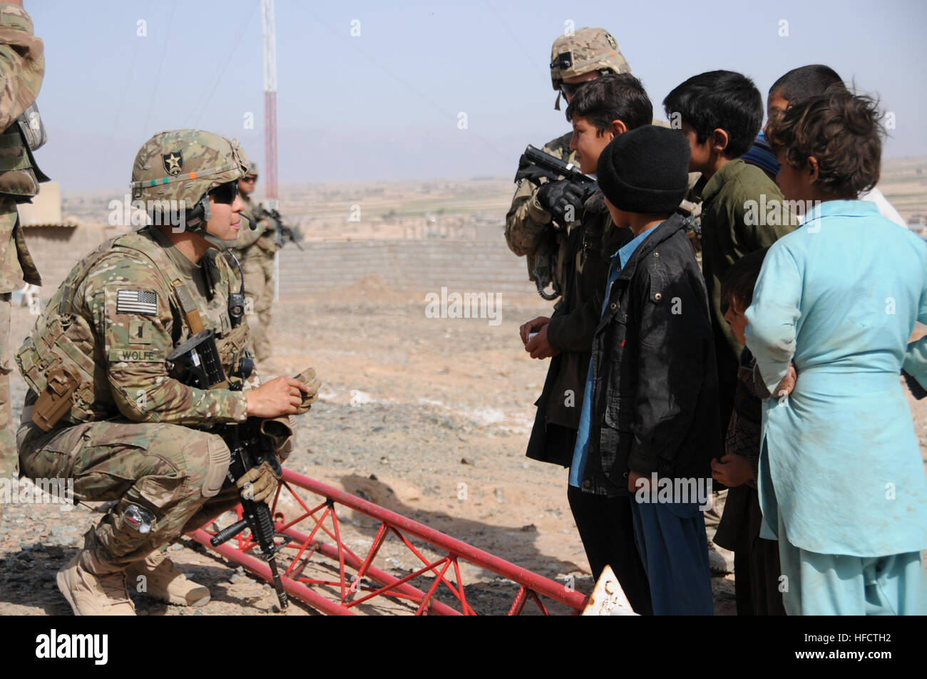 U.S. Army 1st Lt. Robert Wolfe, left, platoon leader for Provincial ...