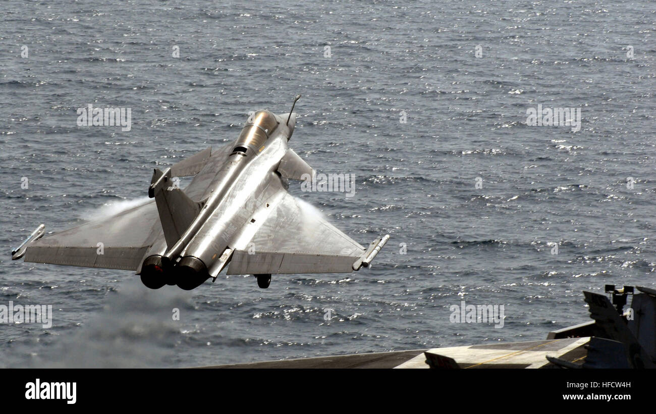 A French Rafale aircraft from the nuclear-powered aircraft carrier ...