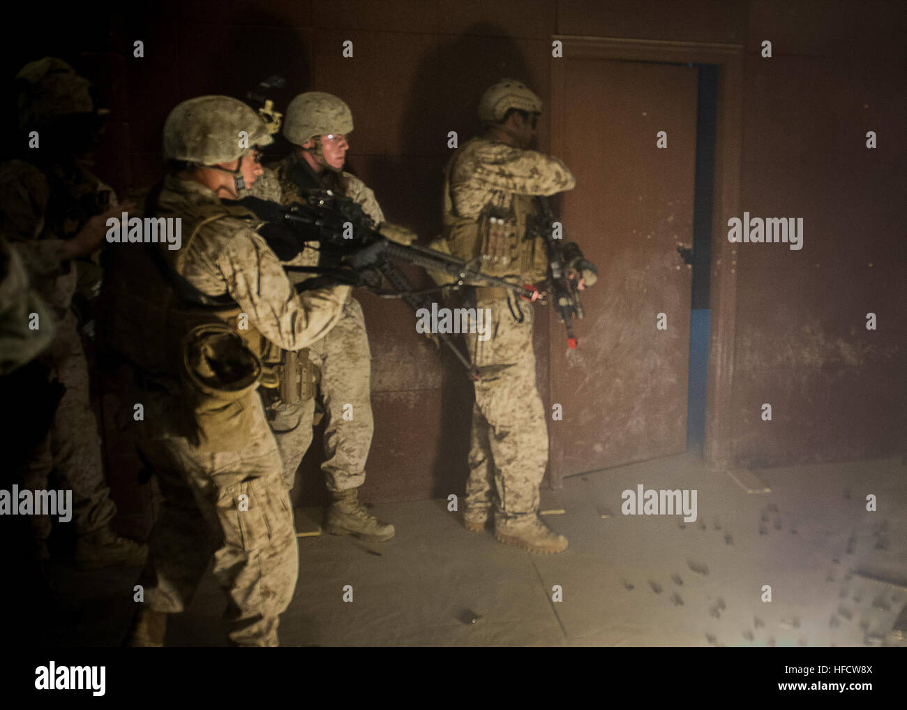 U.S. Navy Explosive Ordnance Disposal (EOD) Technician inspects a ...