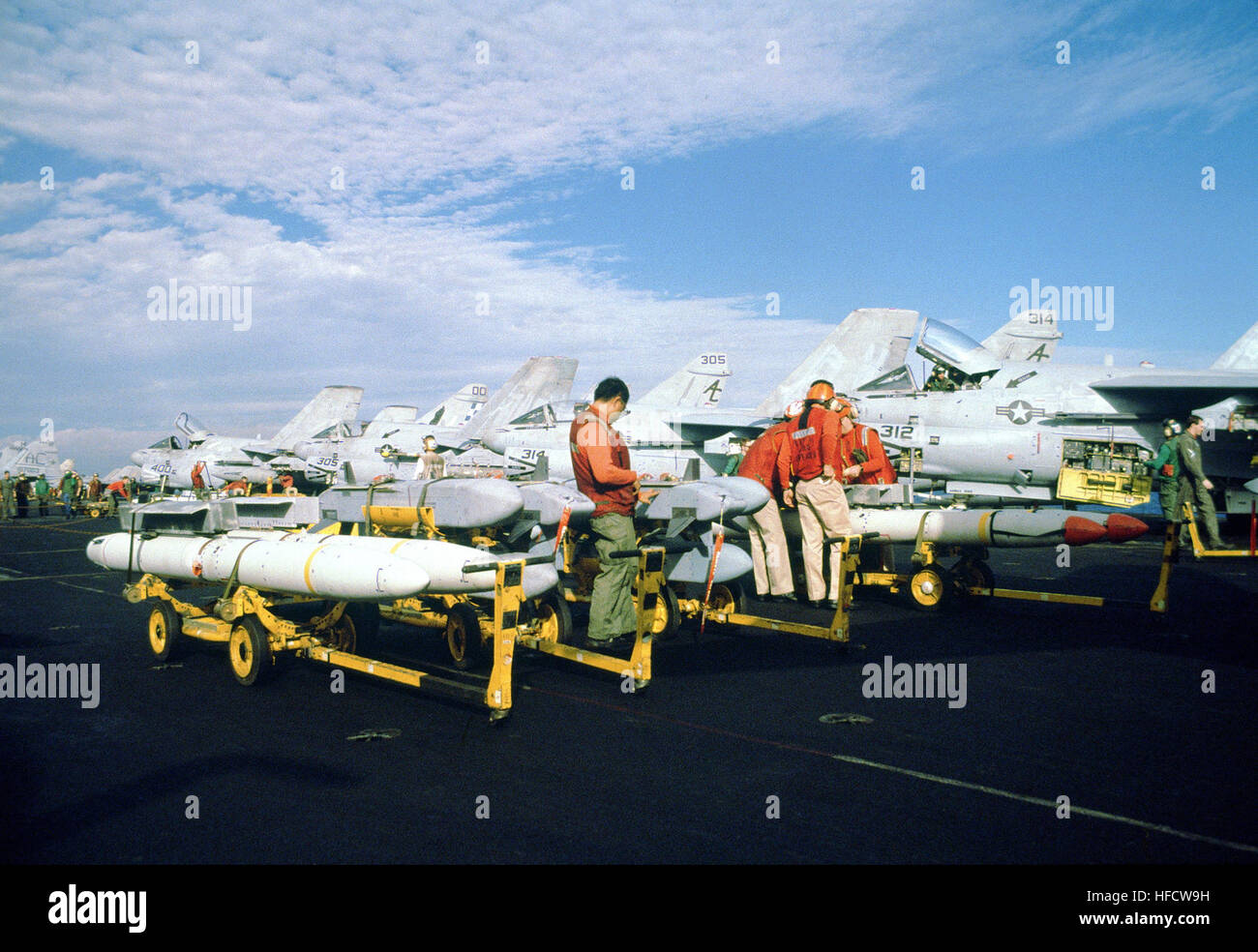 An aviation ordnanceman inspects an ADM-141 Tactical air-launched decoy ...