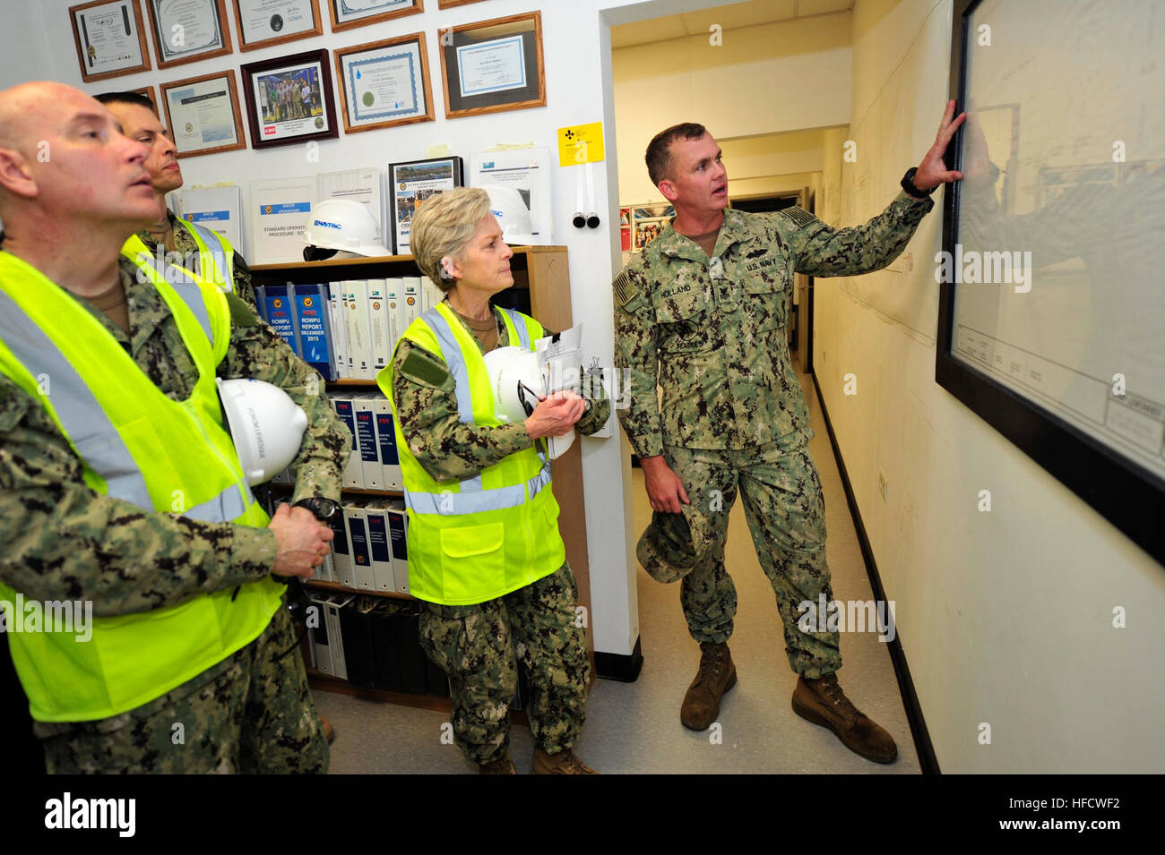 Utilitiesman 1st Class Waverly Holland, right, speaks with Chief of ...