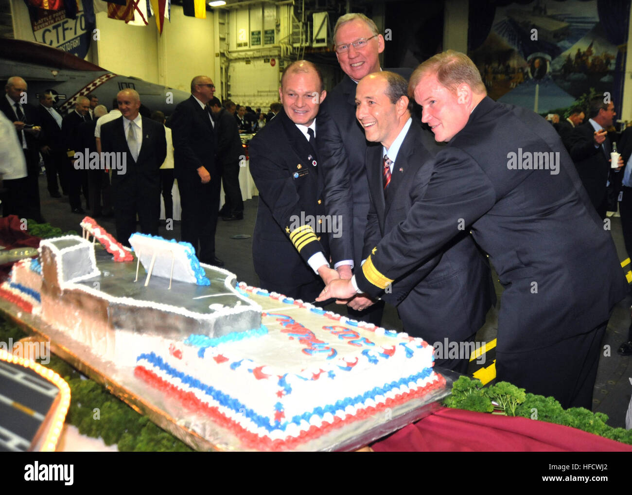 From left, Capt. Greg Fenton, commanding officer of the aircraft ...