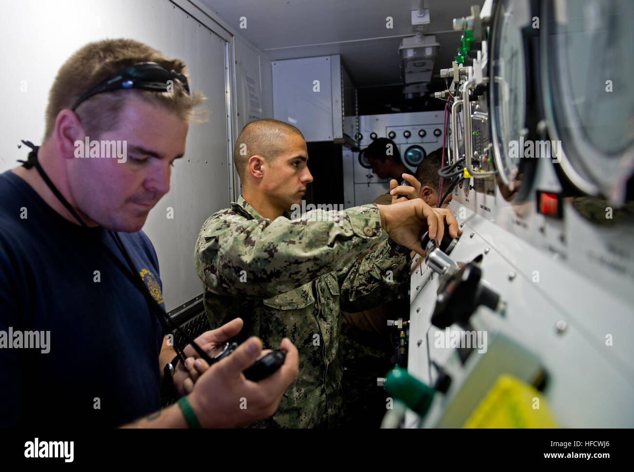 Navy Diver 1st Class James Goodman, left, and Navy Diver 3rd Class ...