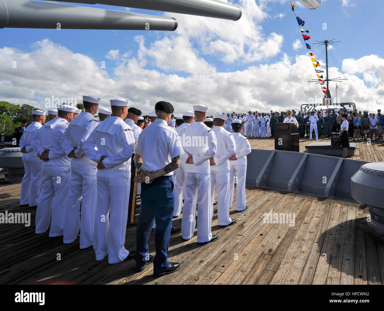 U.S. service members prepare to reenlist during a reenlistment ceremony ...