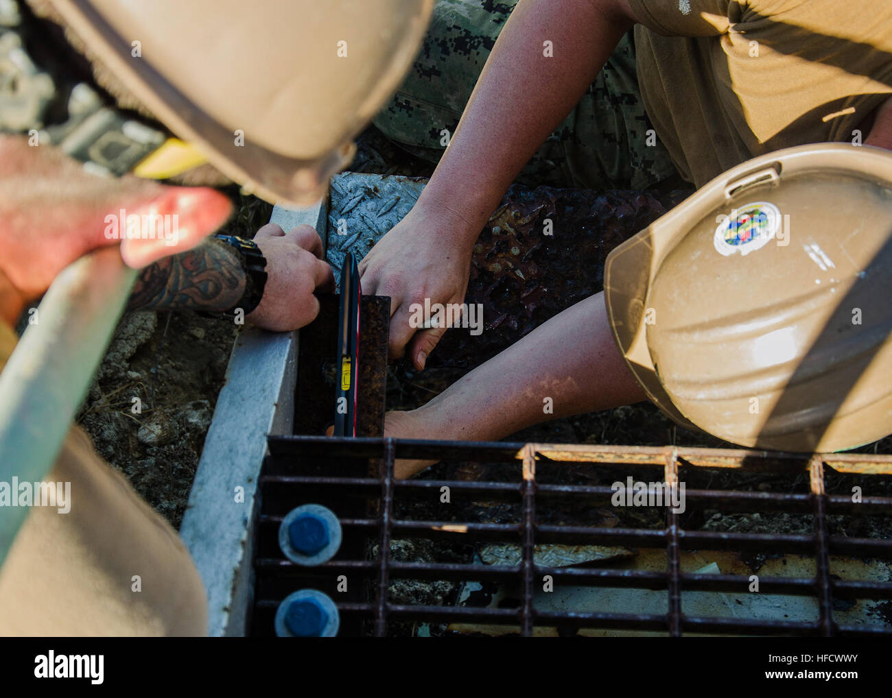 U.S. Navy Builder 3rd Class Jared Allbrittion and Builder 3rd Class ...