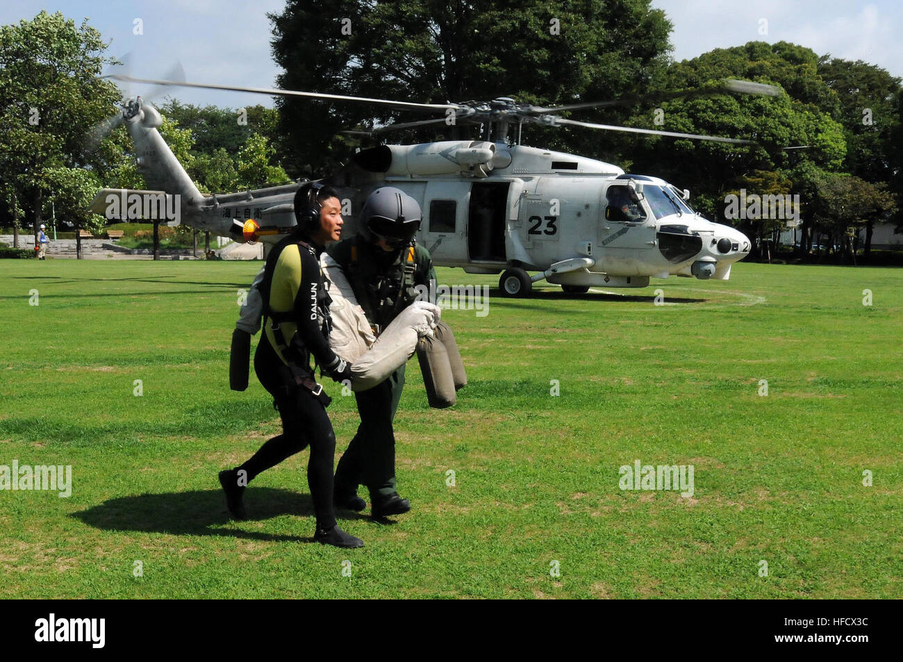 A Japan Maritime Self-Defense Force (JMSDF) aircrew member and rescue ...