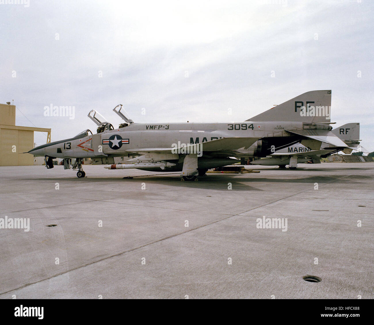 A left side view of an RF-4B Phantom II aircraft on the flight line ...