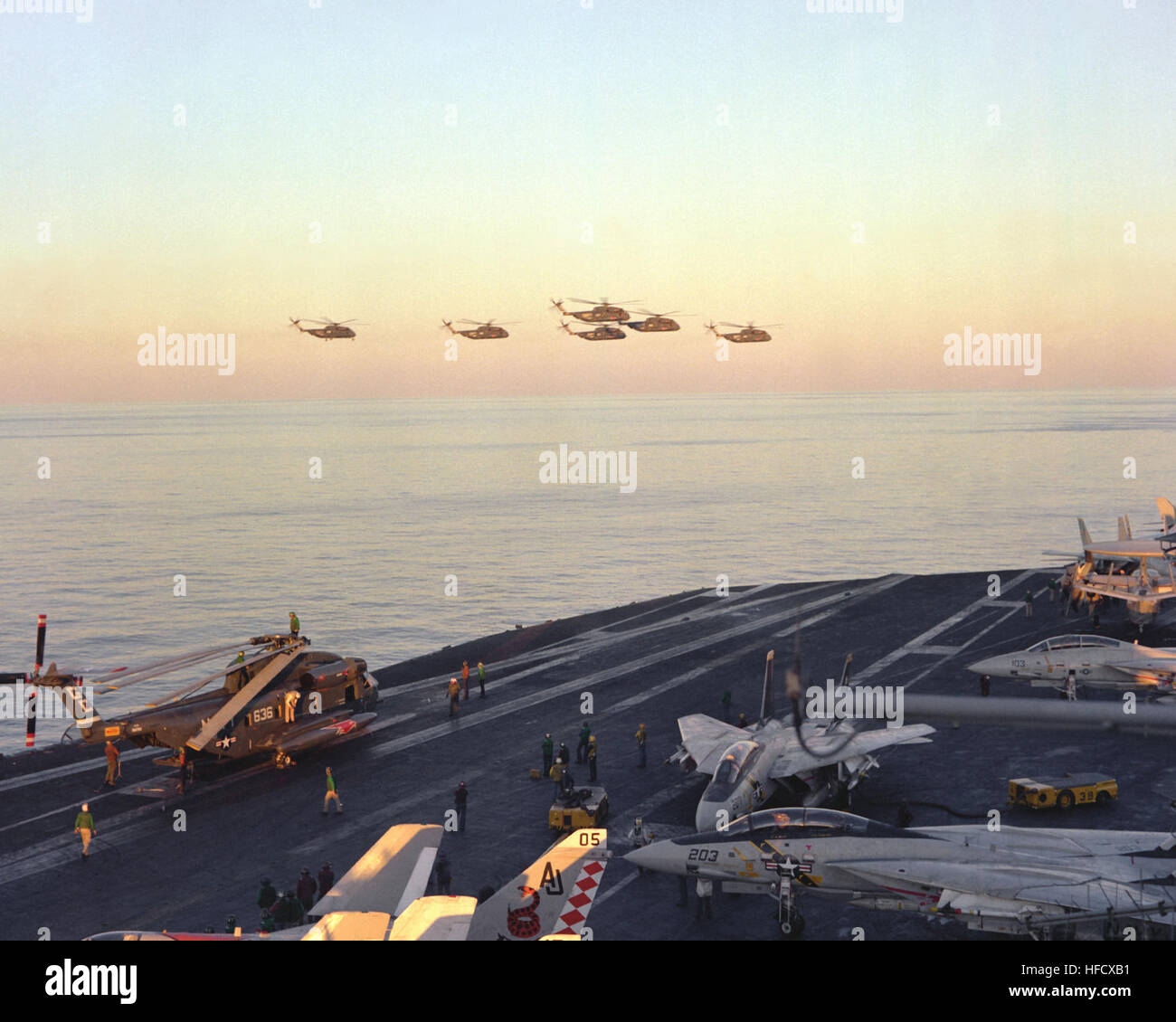 Six RH-53D Sea Stallion helicopters lift off from the flight deck of ...