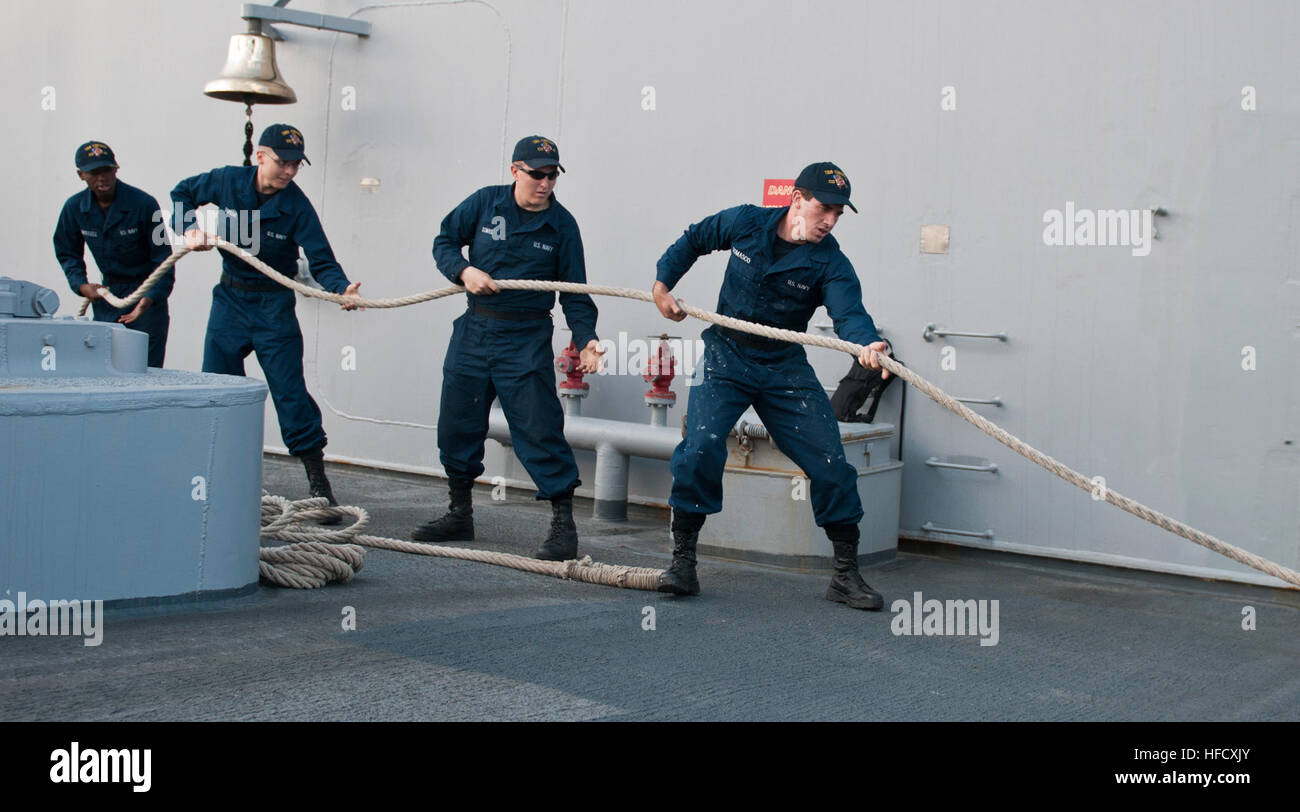 Seaman Apprentice Christopher Tomasco heaves a line aboard the guided ...