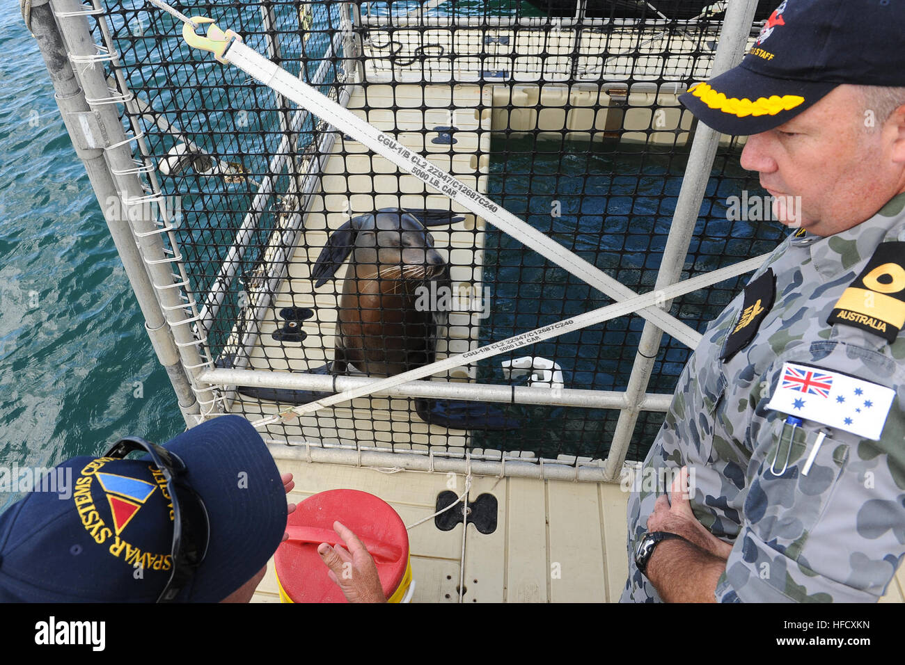 Royal Australian Navy Commodore Stuart Mayer, right, talks with a U.S ...